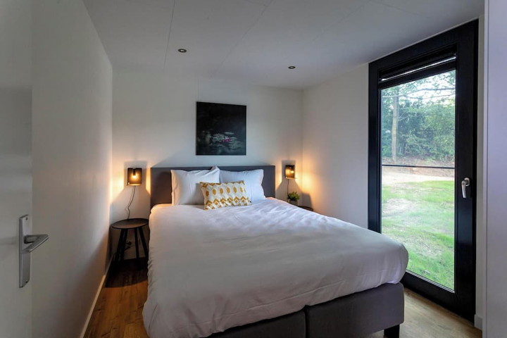 Stylish Water Cube For 5 Guests With Modern Interior Walk In Shower And Large Terrace Floating Above The Water. - Venlo