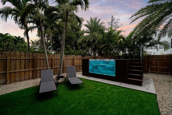 Stylish Outdoor Kitchen And Modern Pool - Tropical Tranquility Retreat - Fort Lauderdale, FL